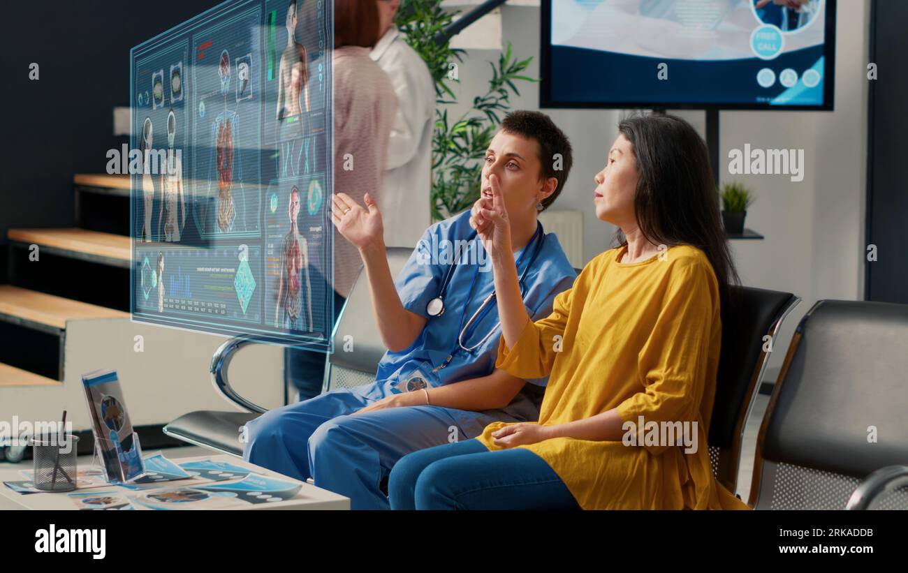 Neurologist in modern lab lobby showing elderly asian patient ...