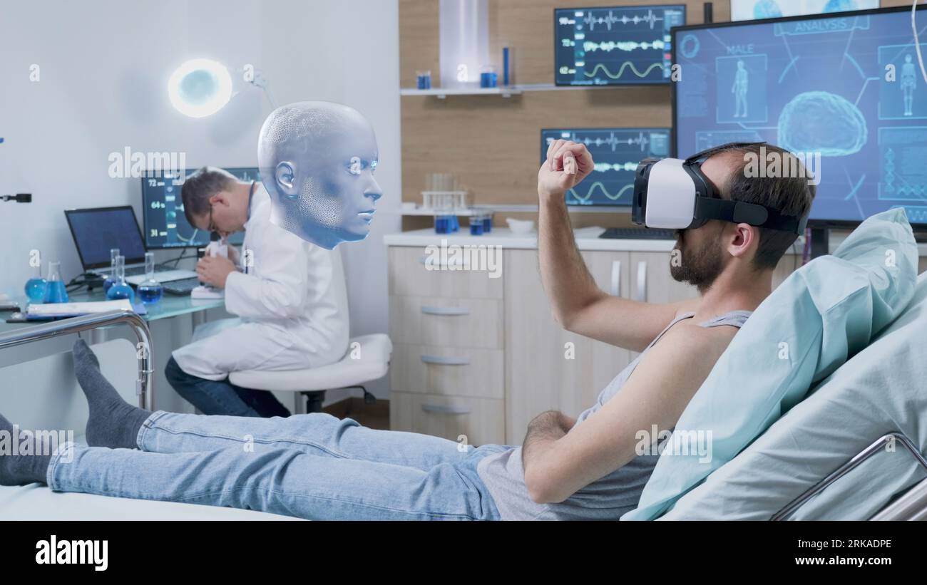Patient laying in clinic bed wearing virtual reality headset, seeing ...