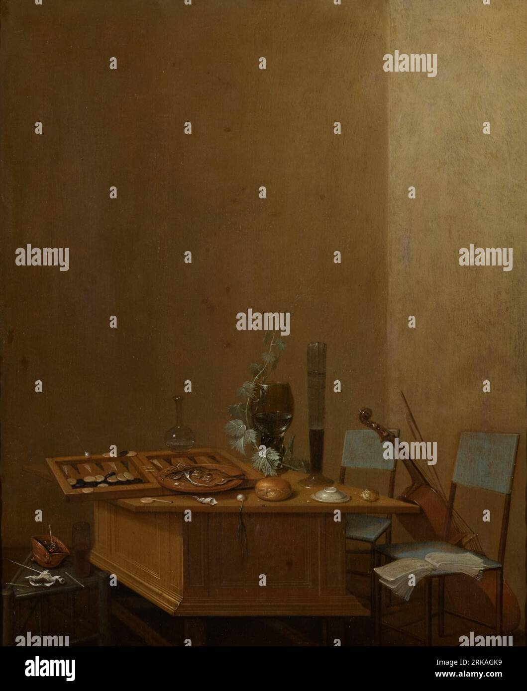 Still life with tric-trac game on a wooden table, chairs and a cello to ...