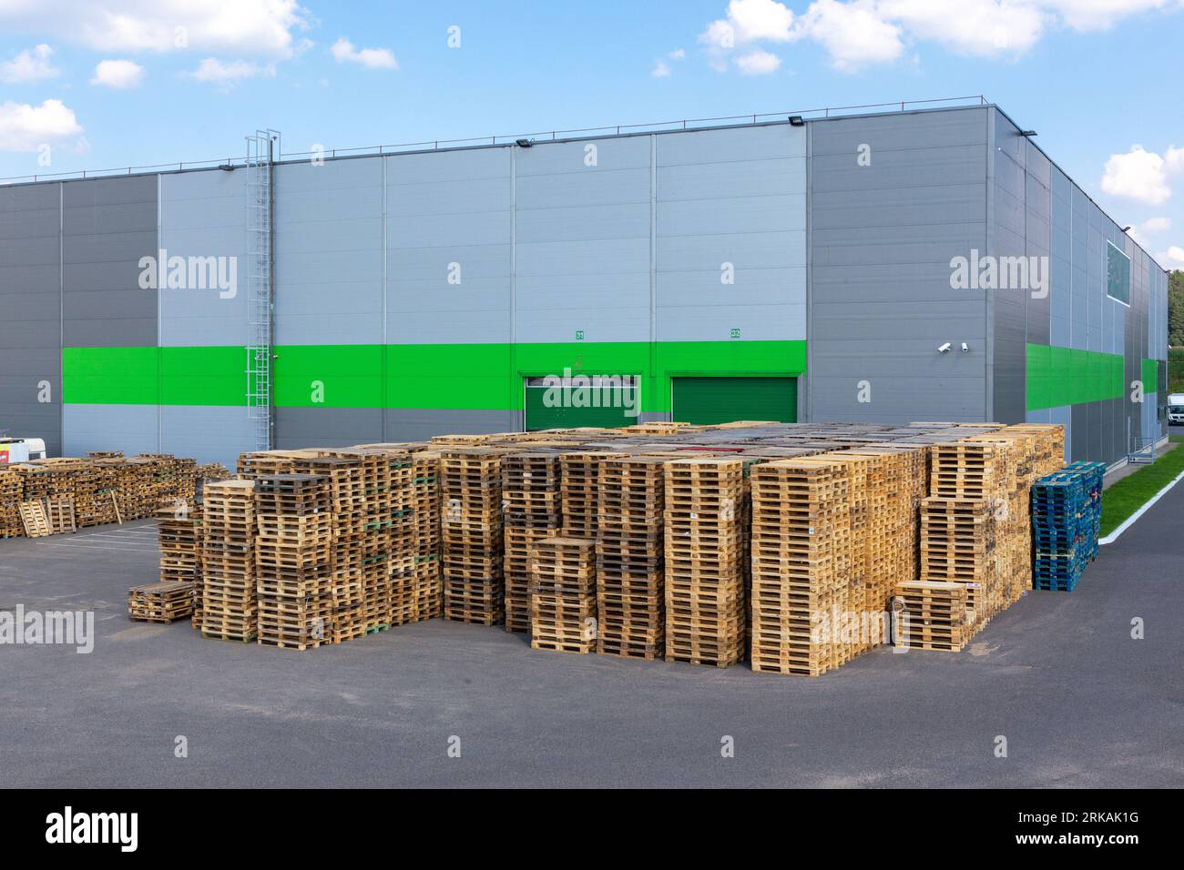 Wooden pallets heap in the cargo warehouse for transportation and ...