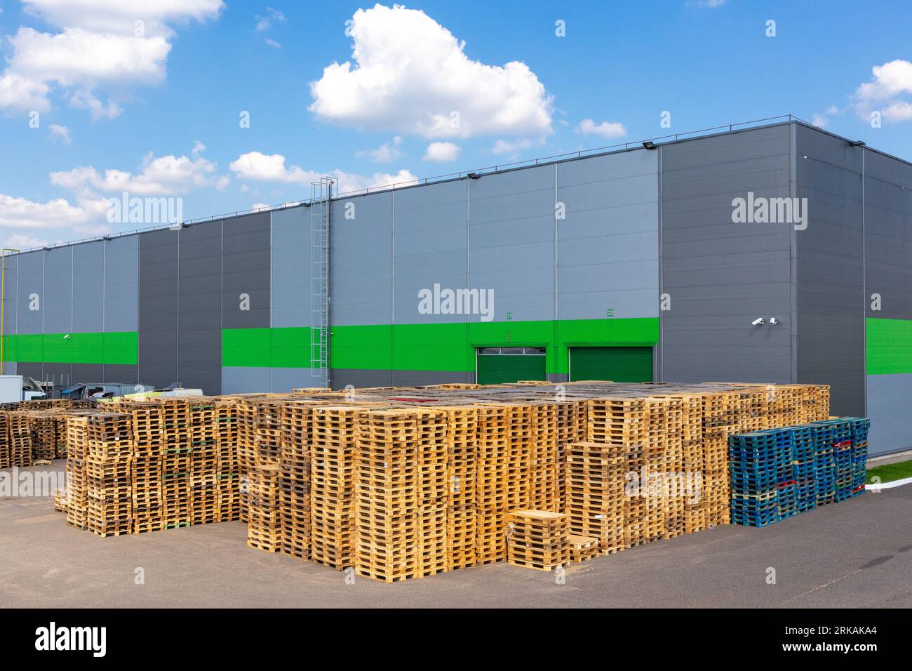 Wooden pallets heap in the cargo warehouse for transportation and ...
