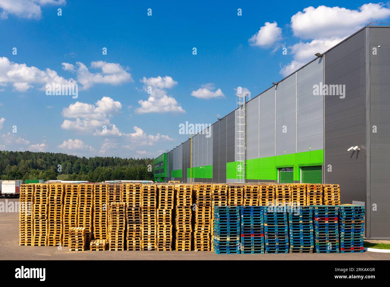 Wooden pallets heap in the cargo warehouse for transportation and ...