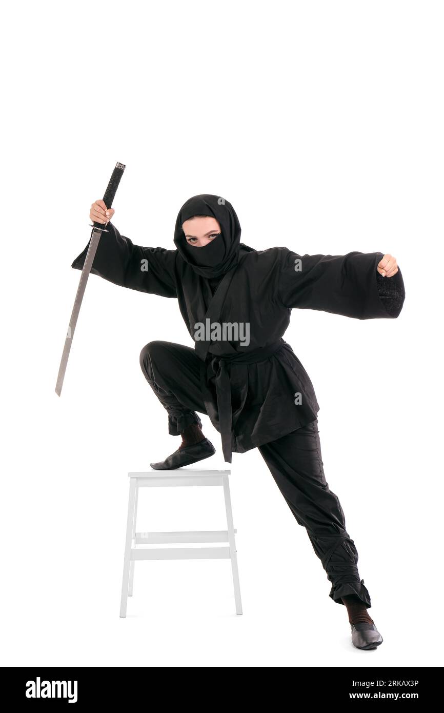 Female ninja with sword on white background Stock Photo - Alamy