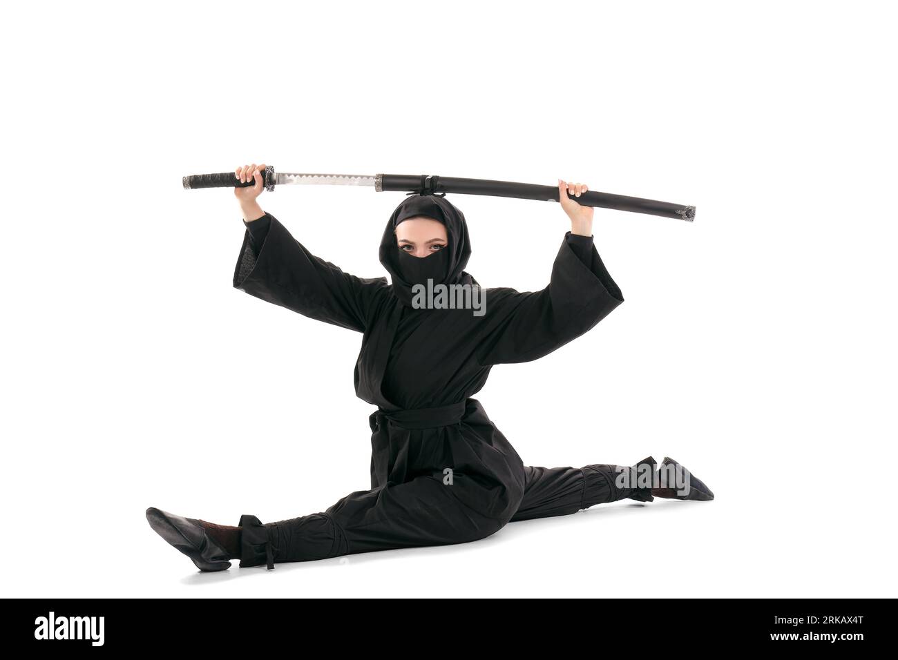 Female ninja with sword isolated on white Stock Photo - Alamy