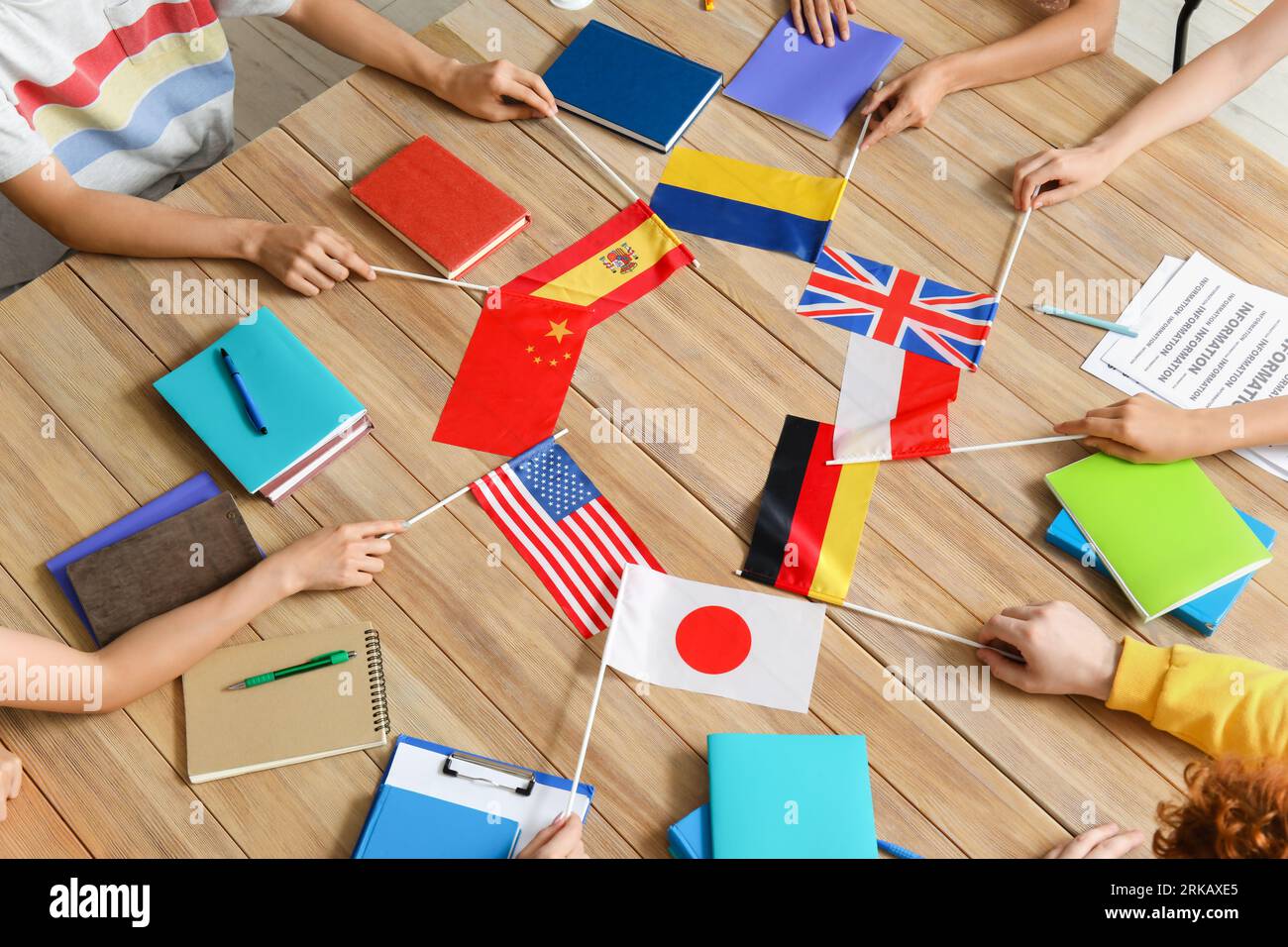 Young students with flags at language school, top view Stock Photo - Alamy