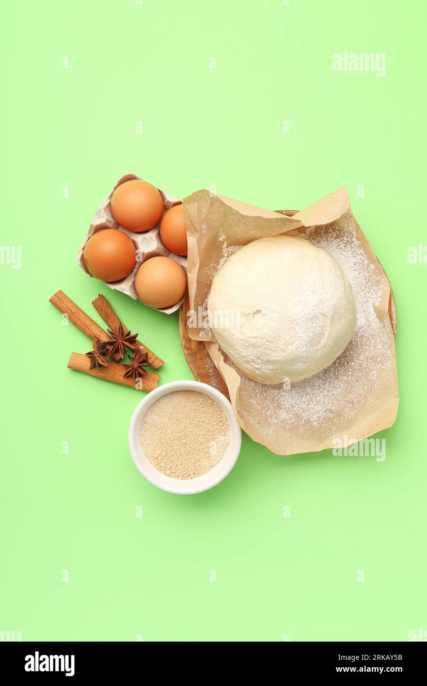 Composition with raw dough, yeast, eggs and spices for preparing bakery ...