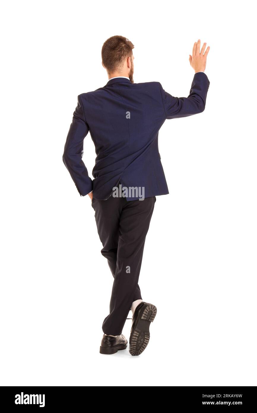 Business in suit waving hand on white background, back view Stock Photo ...