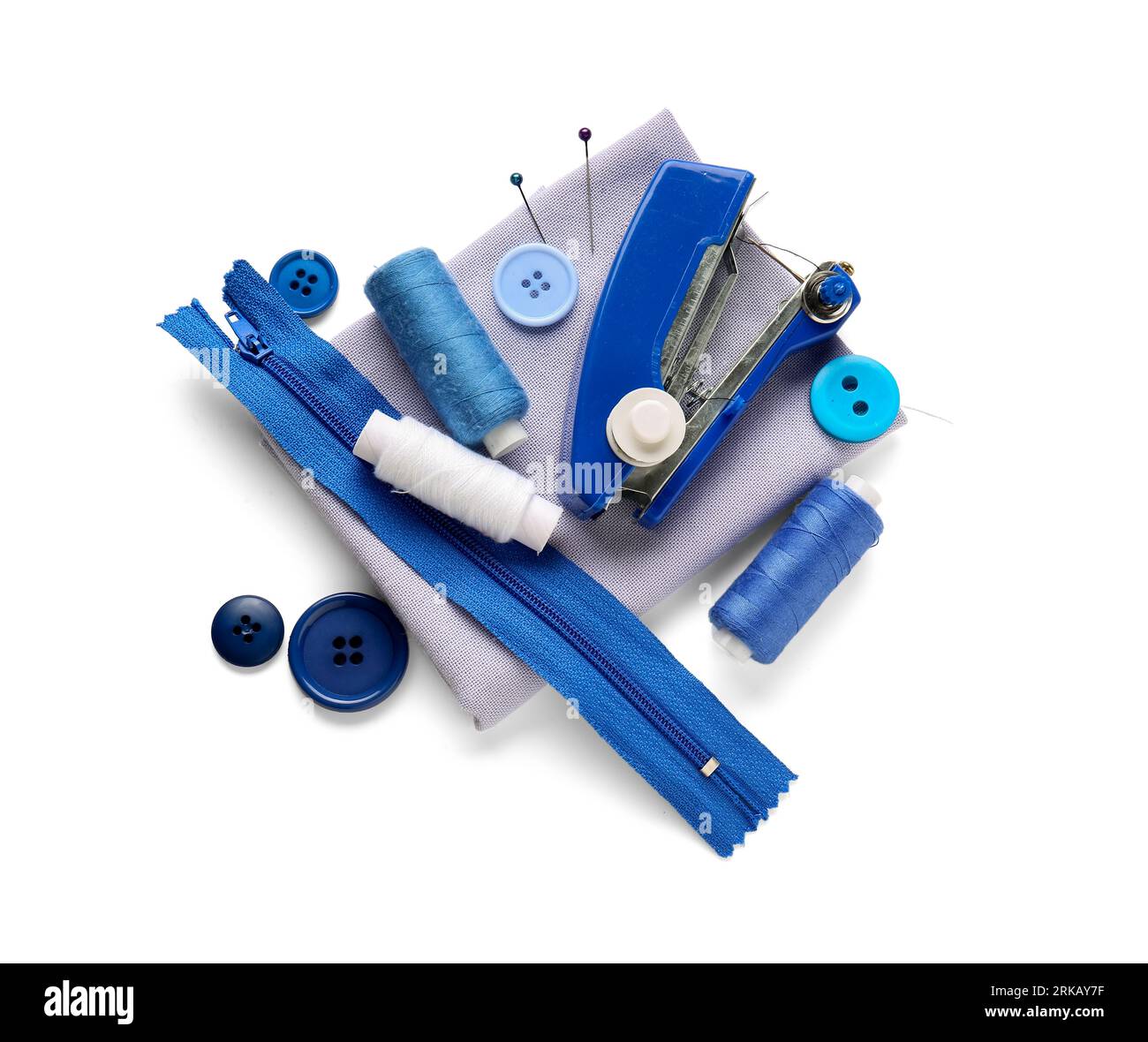 Manual sewing machine with thread spools, zipper, buttons and cloth ...