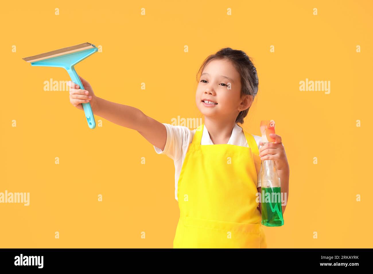 Cute little janitor with squeegee and detergent on yellow background ...