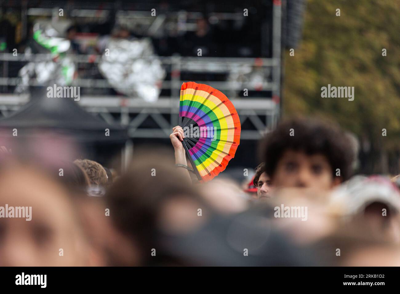 An attendee waves the LGBT coloured fan amidst the crowd at Rock en ...