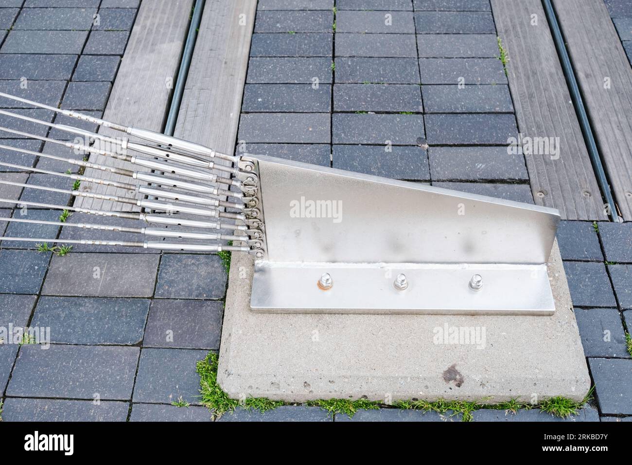 Steel stays attached to a support driven into the ground hold the steel ...