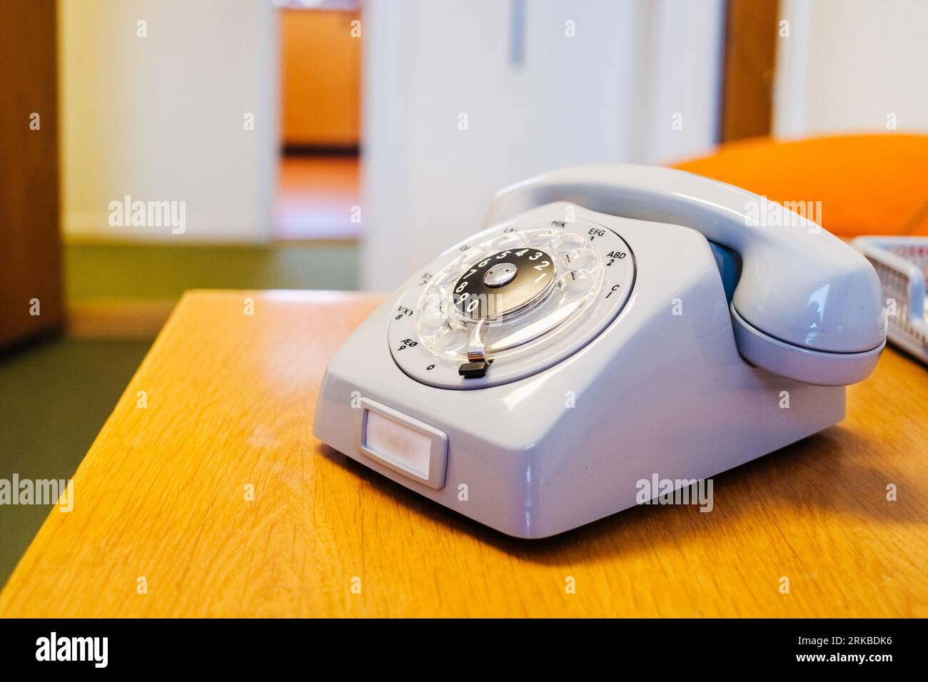 Old wheel and cord telephone, white, vintage Stock Photo - Alamy