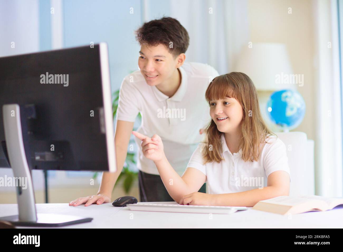 Kids in school class. Children working on school project. IT, coding and computer lesson ...