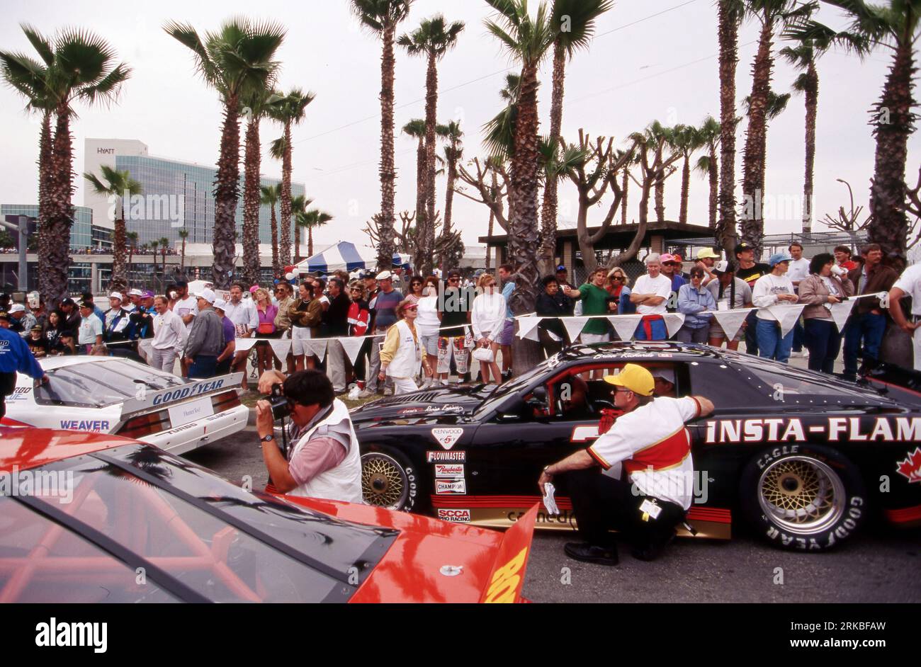 Fans get a close view of race cars before the Toyota Long Beach Grand ...