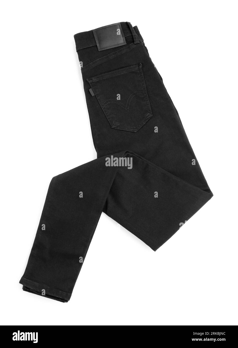 Folded black jeans isolated on white, top view Stock Photo - Alamy