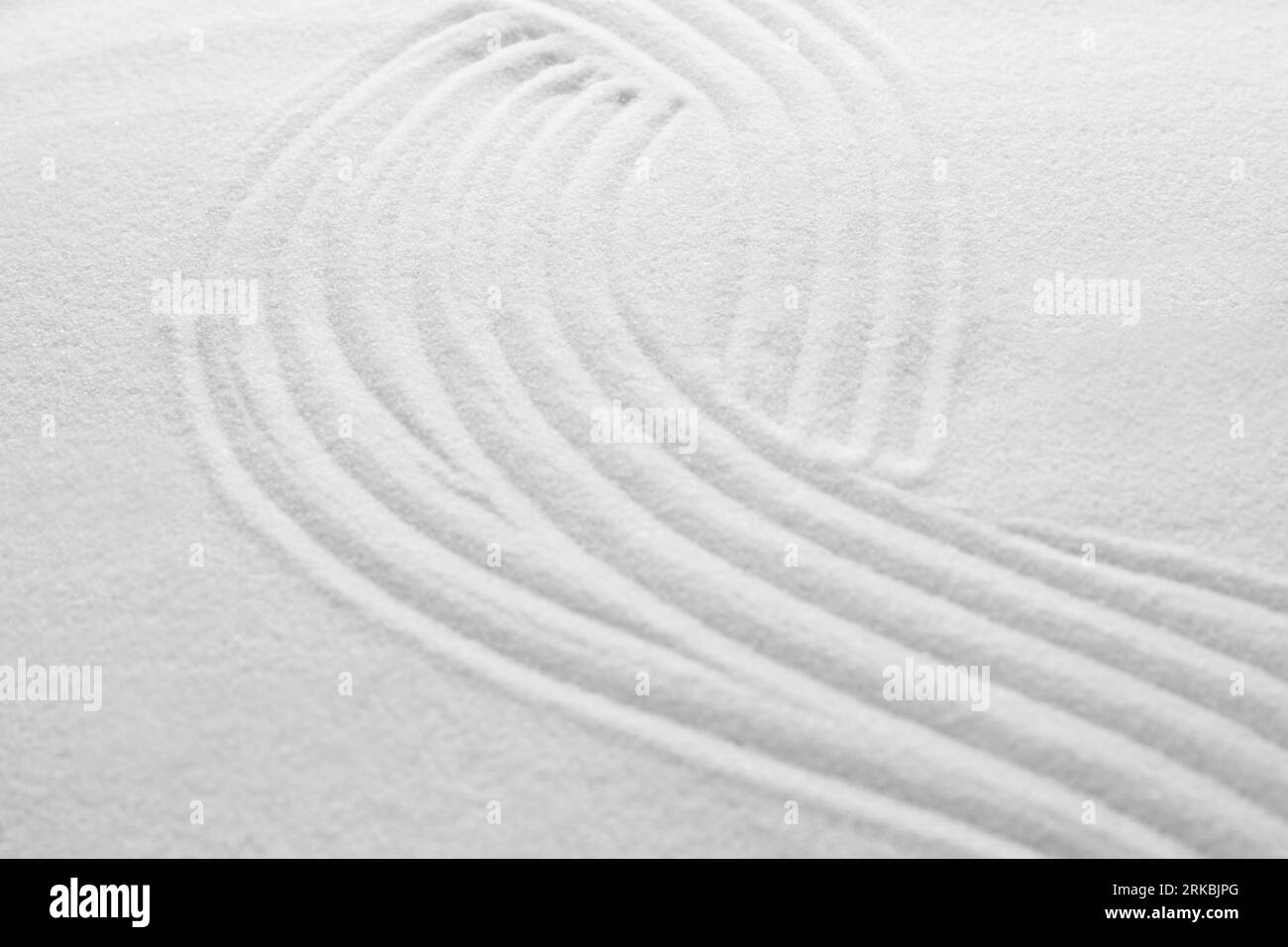 White sand with pattern as background, closeup. Concept of zen and ...