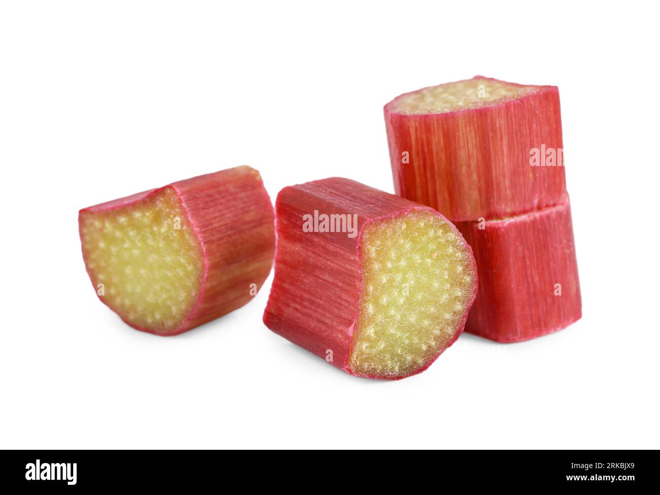 Pieces of ripe rhubarb isolated on white Stock Photo - Alamy