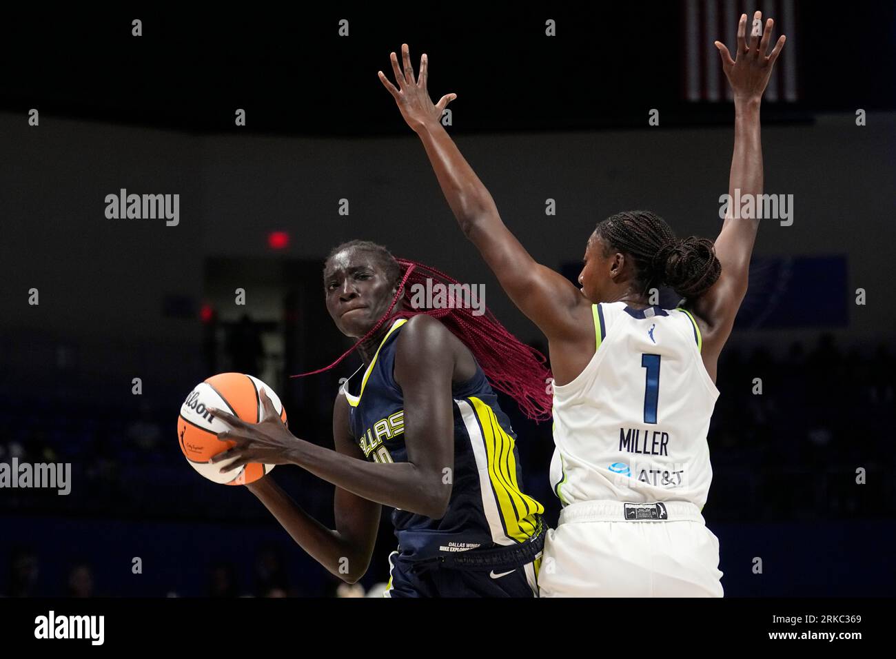 Dallas Wings center Awak Kuier, left, works for a shot as Minnesota ...