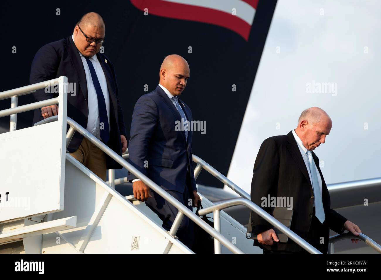From left, Steven Cheung, Walt Nauta and attorney Steven Sadow walk ...