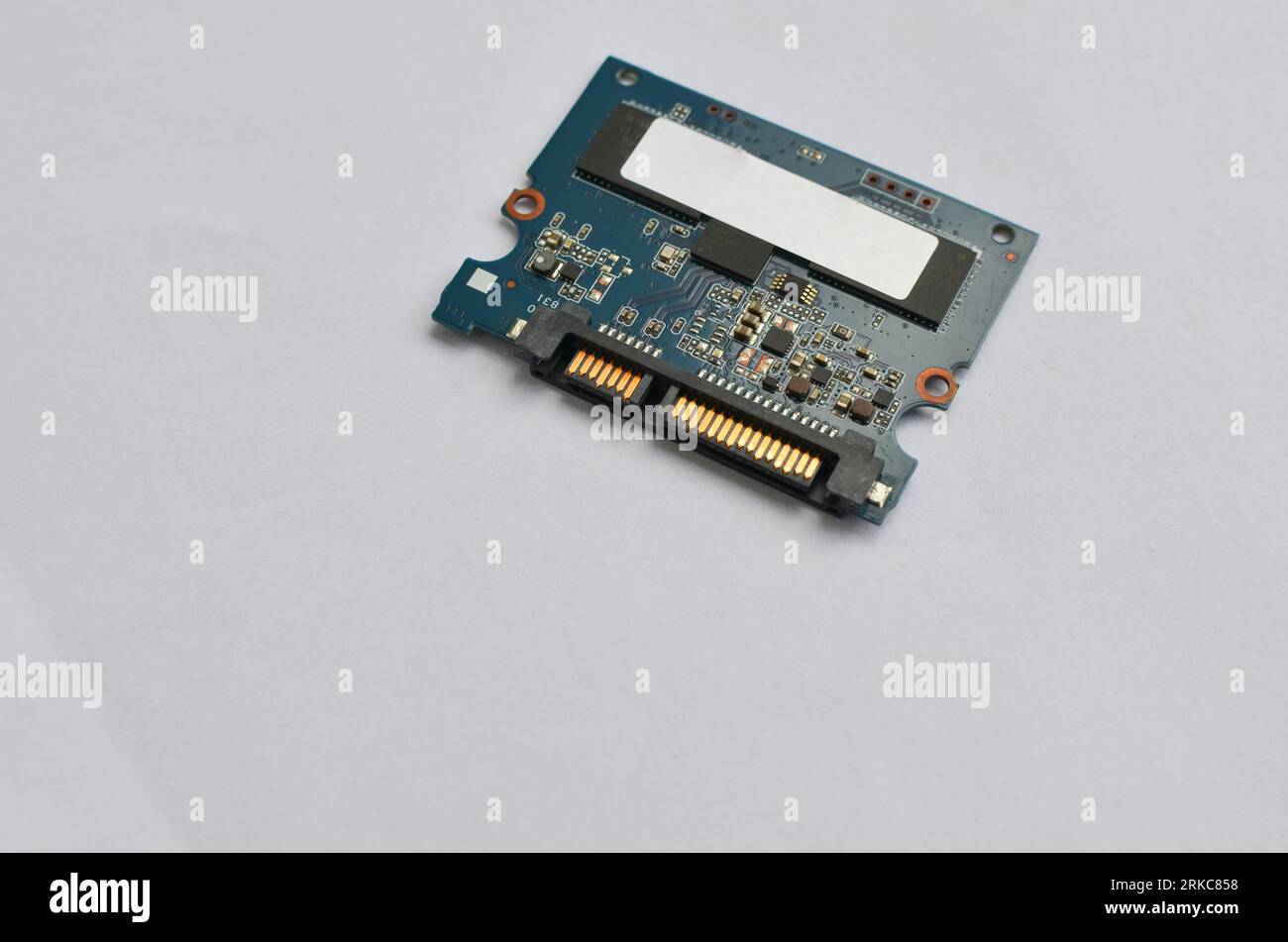 Detail of open SSD with exposed logic board for repair and data ...