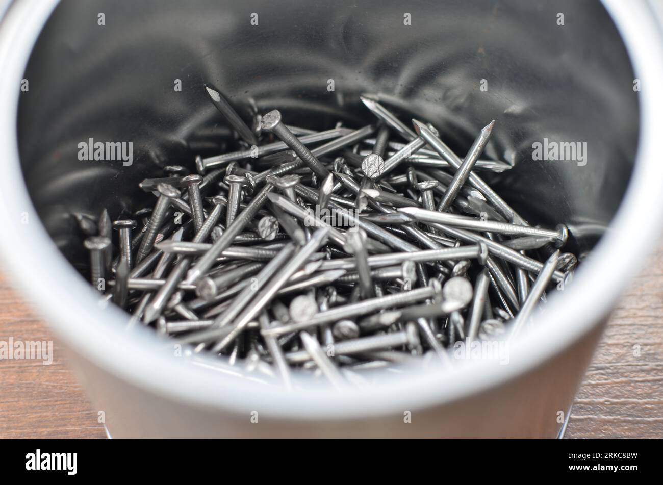 Detailed closeup of several steel nails, perfect for illustrating or ...