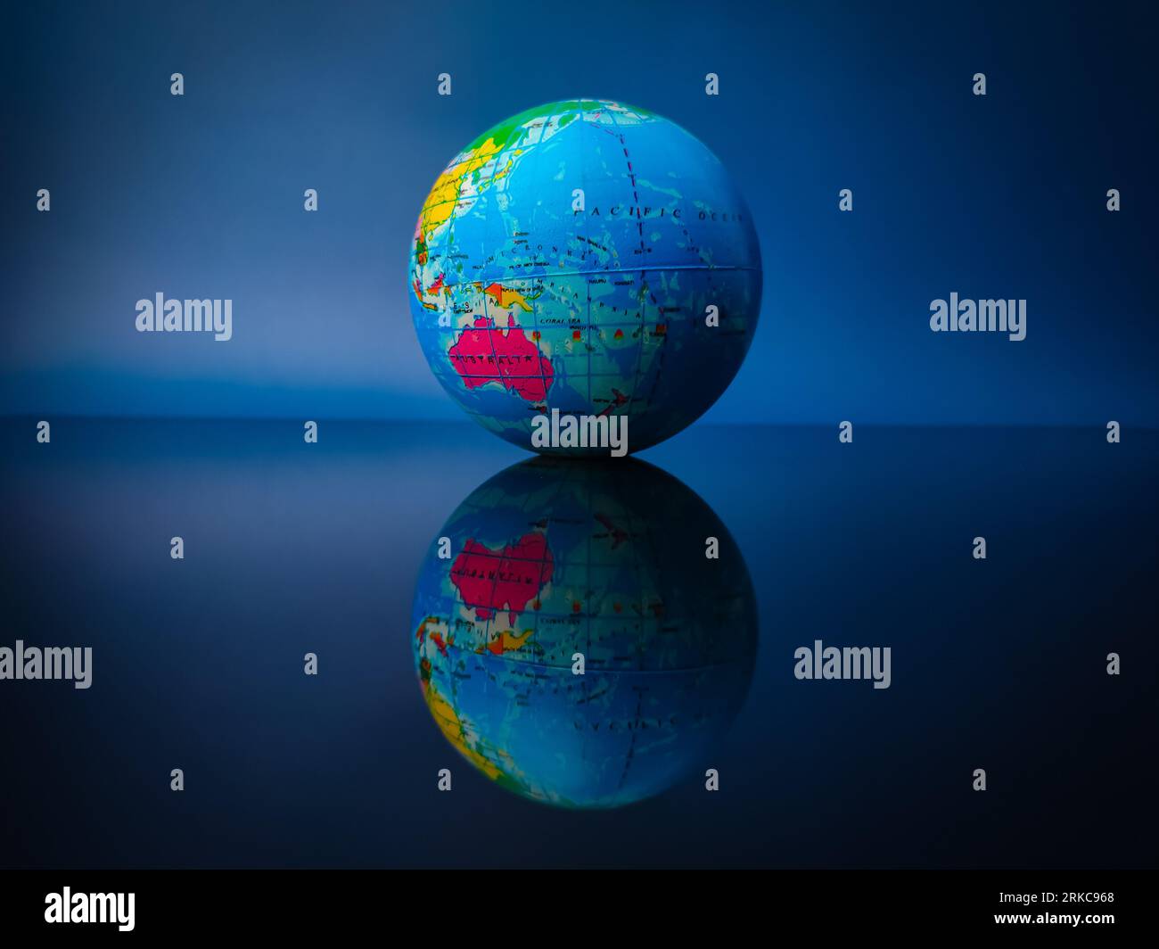 Earth globe with reflection on a black acrylic board Stock Photo - Alamy