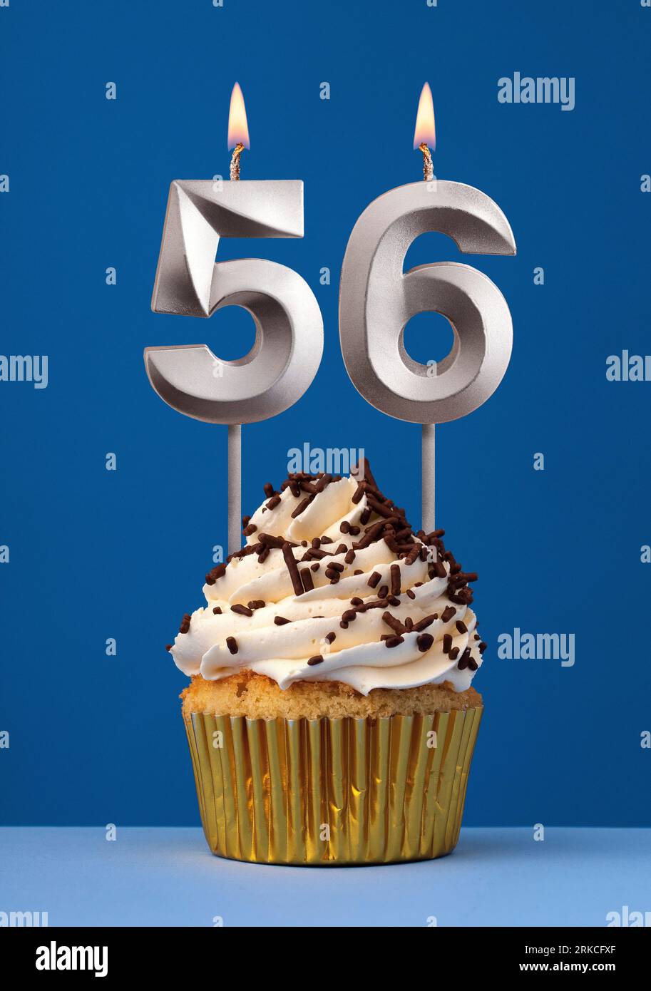 Vertical birthday card with cake - Lit candle number 56 on blue ...