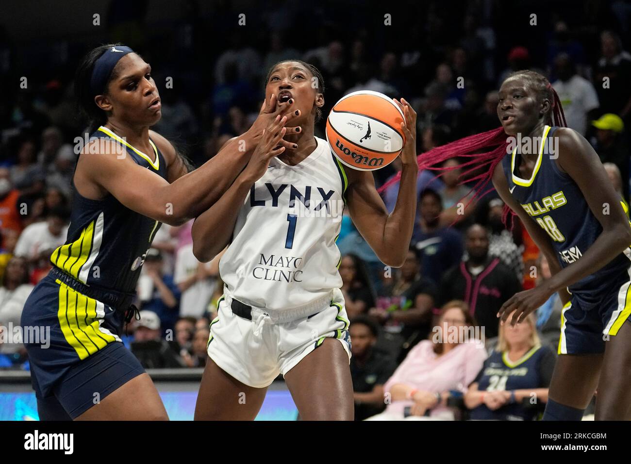 Minnesota Lynx guard Diamond Miller (1) works to the basket for a shot ...