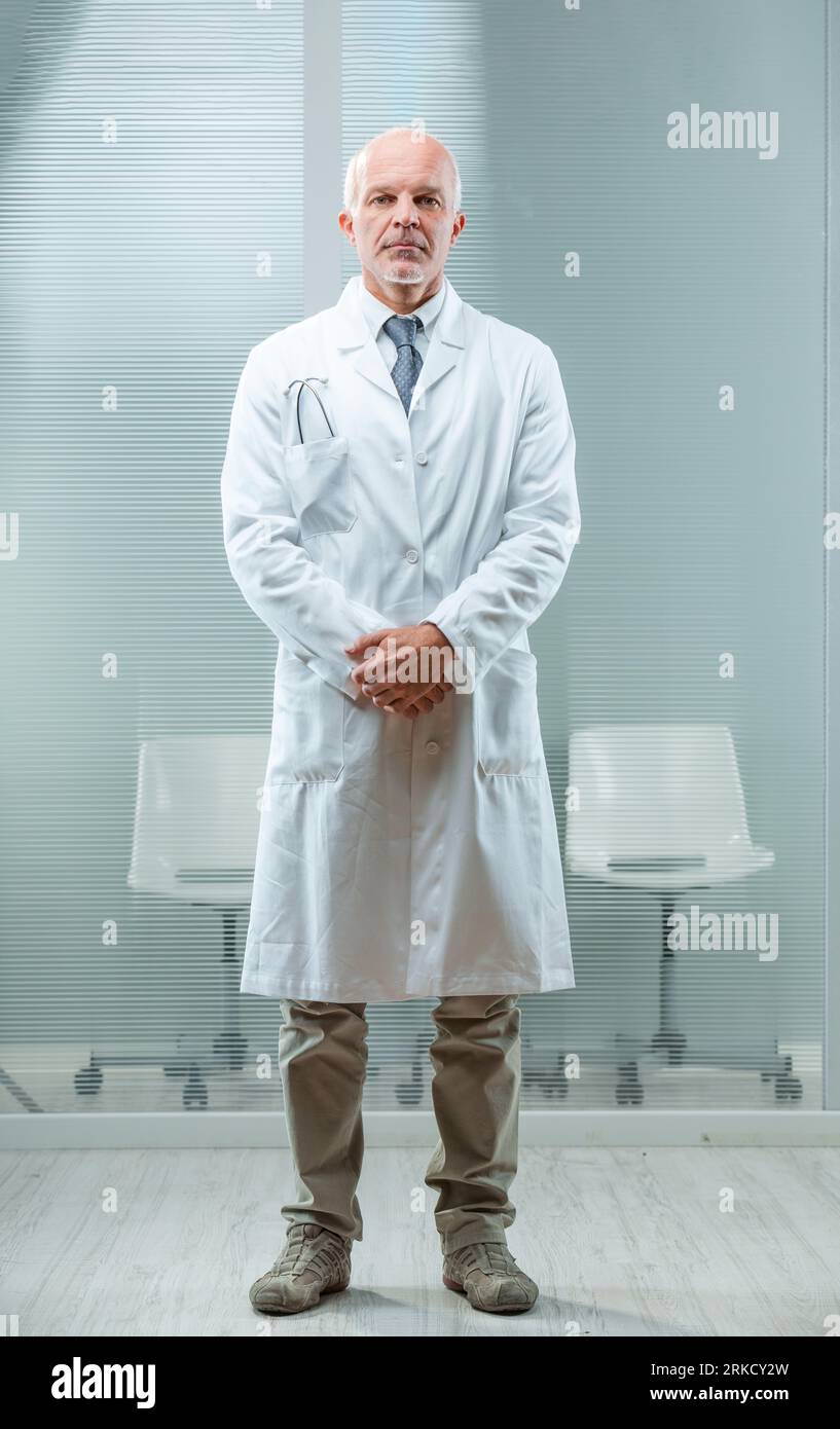 devoted healthcare worker in white coat stands with determination ...