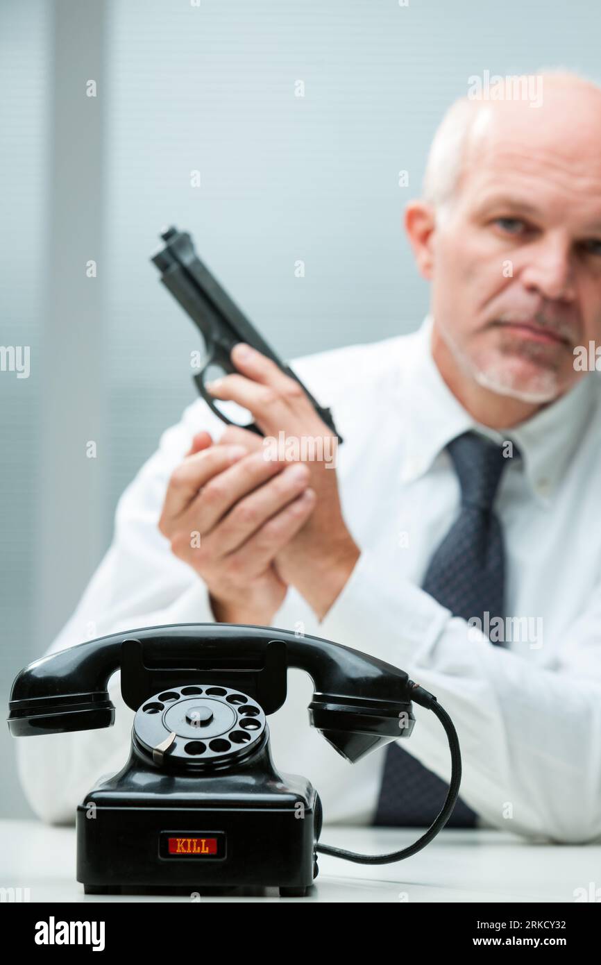 On an old-fashioned, black dial phone, a red and yellow backlit message ...