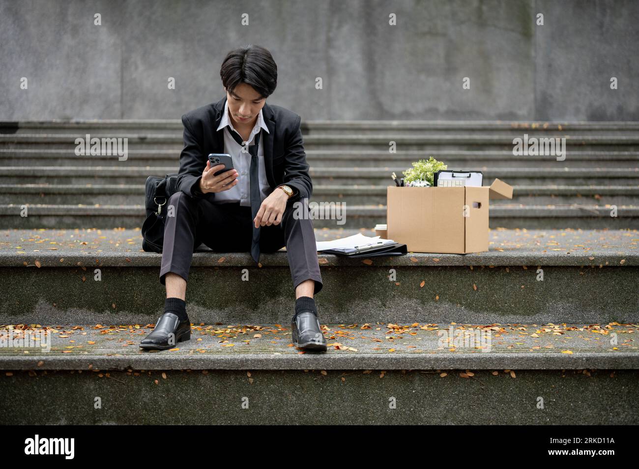 Stressed and depressed young Asian businessman or male office worker ...