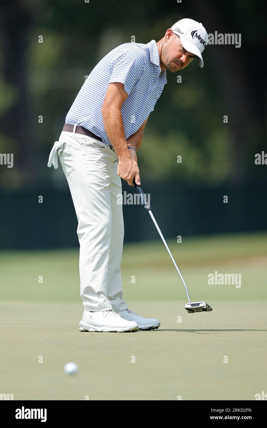 Brian Harman sinks a birdie putt on the first green during the first ...