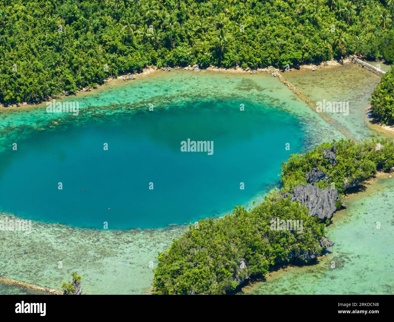 Birds eye view of turquoise water in lagoons of Tropical Island. Coral ...