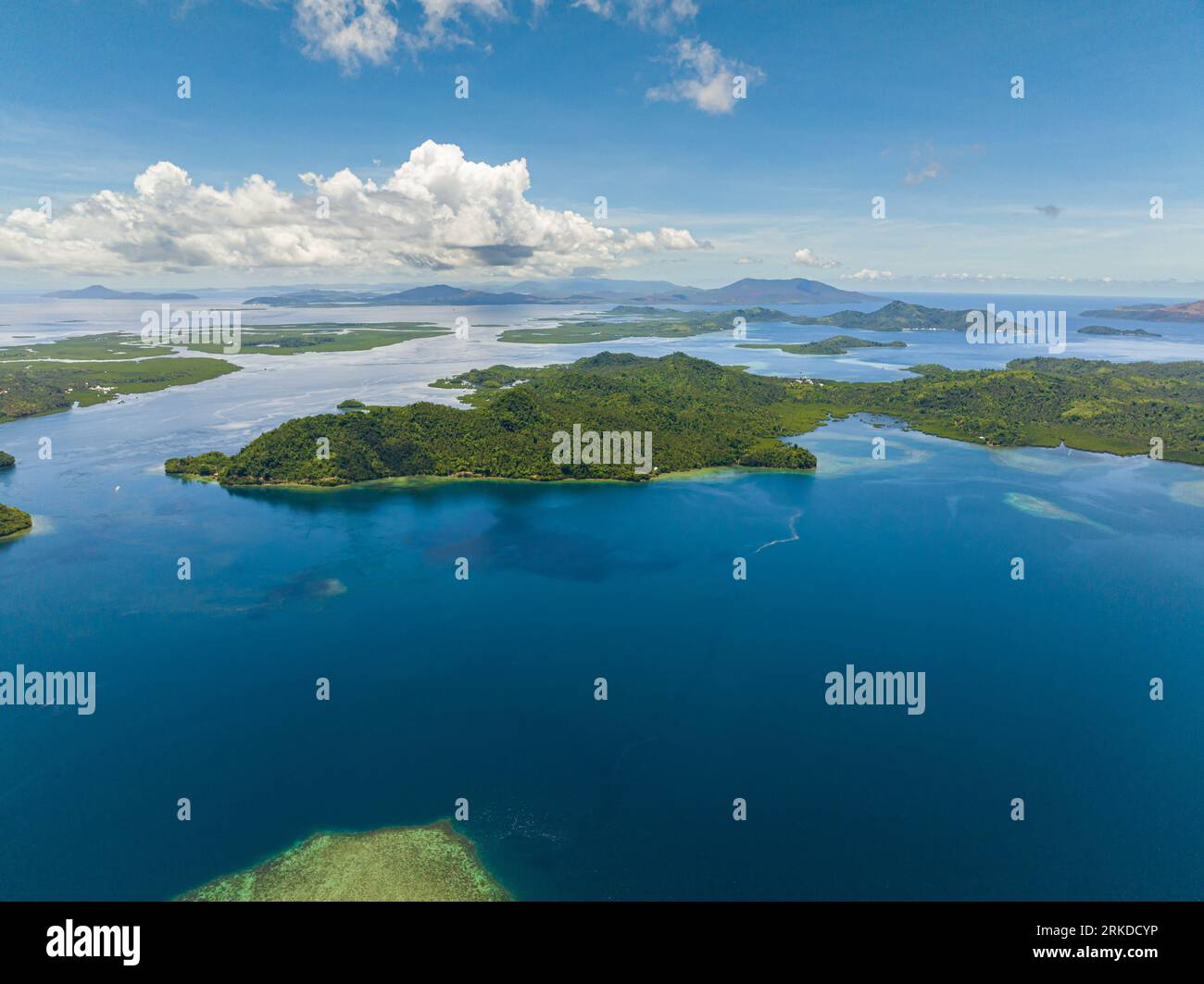 Tropical islands surrounded by blue water and sky landscape, travel ...