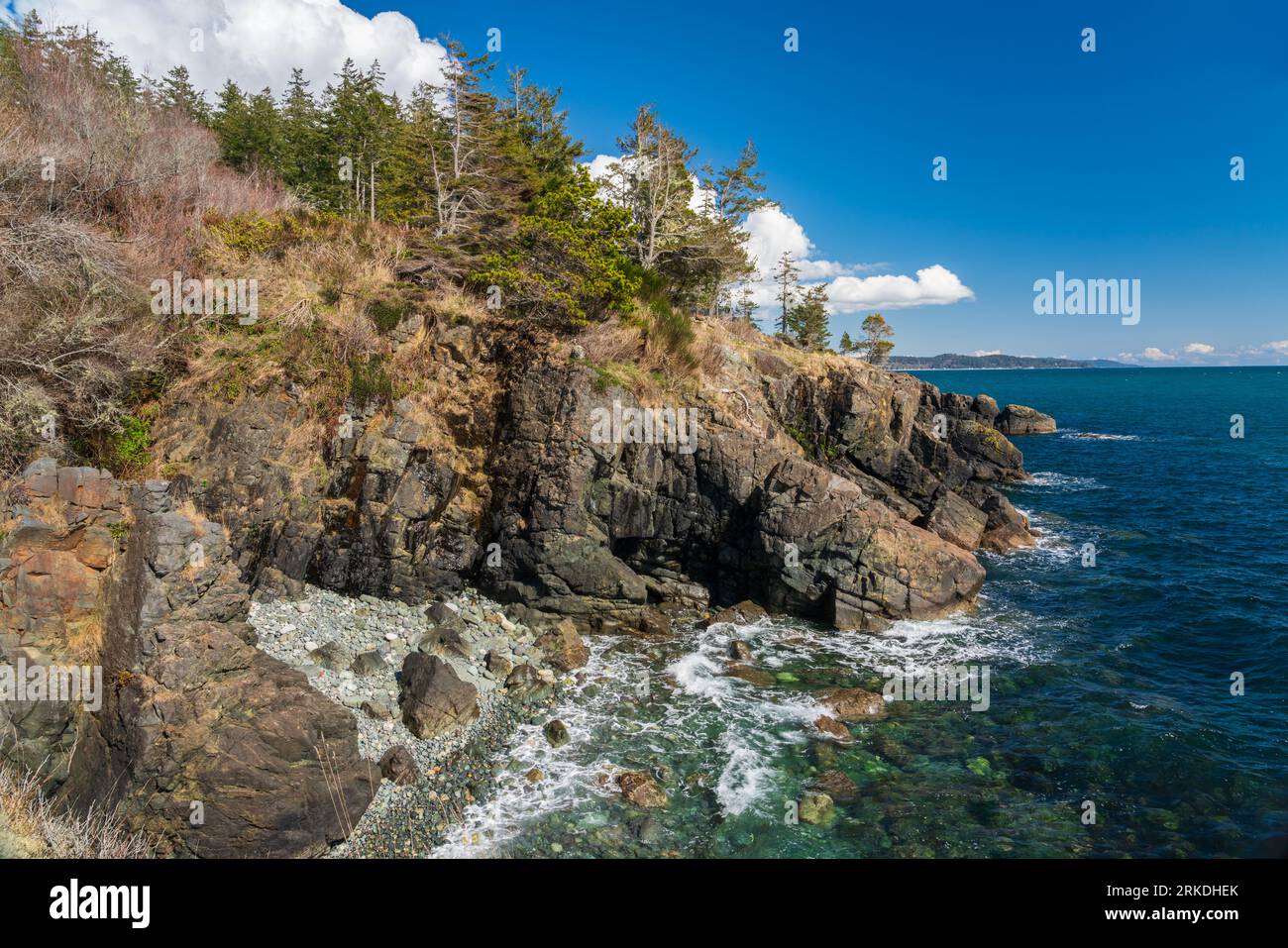 The coastline at the Shweinham Point Lighthouse overlooking the Strait ...