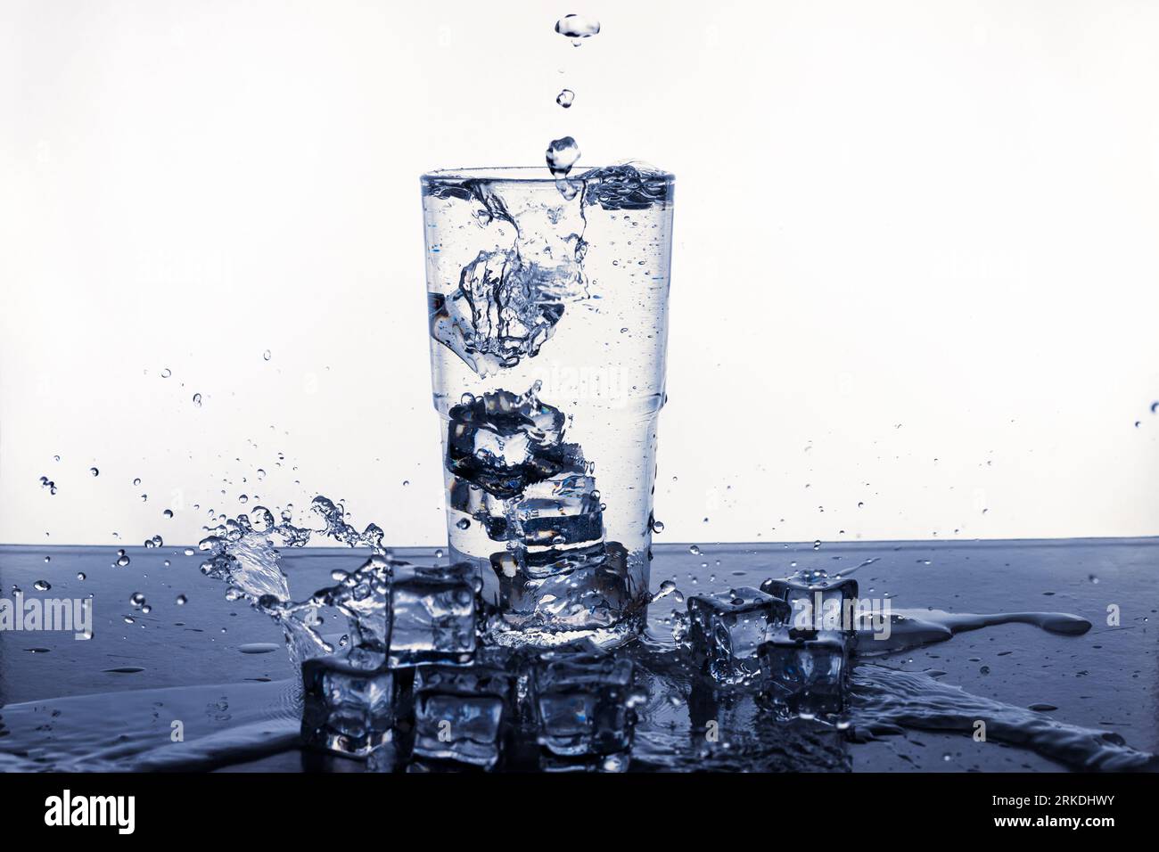 Water splash in a glass on a white background. Water bubbles. Isolated ...