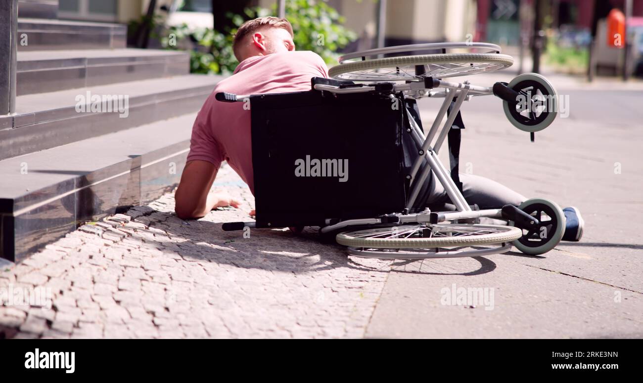 Wheelchair Fall Accident. Sad Man In Pain Stock Photo - Alamy