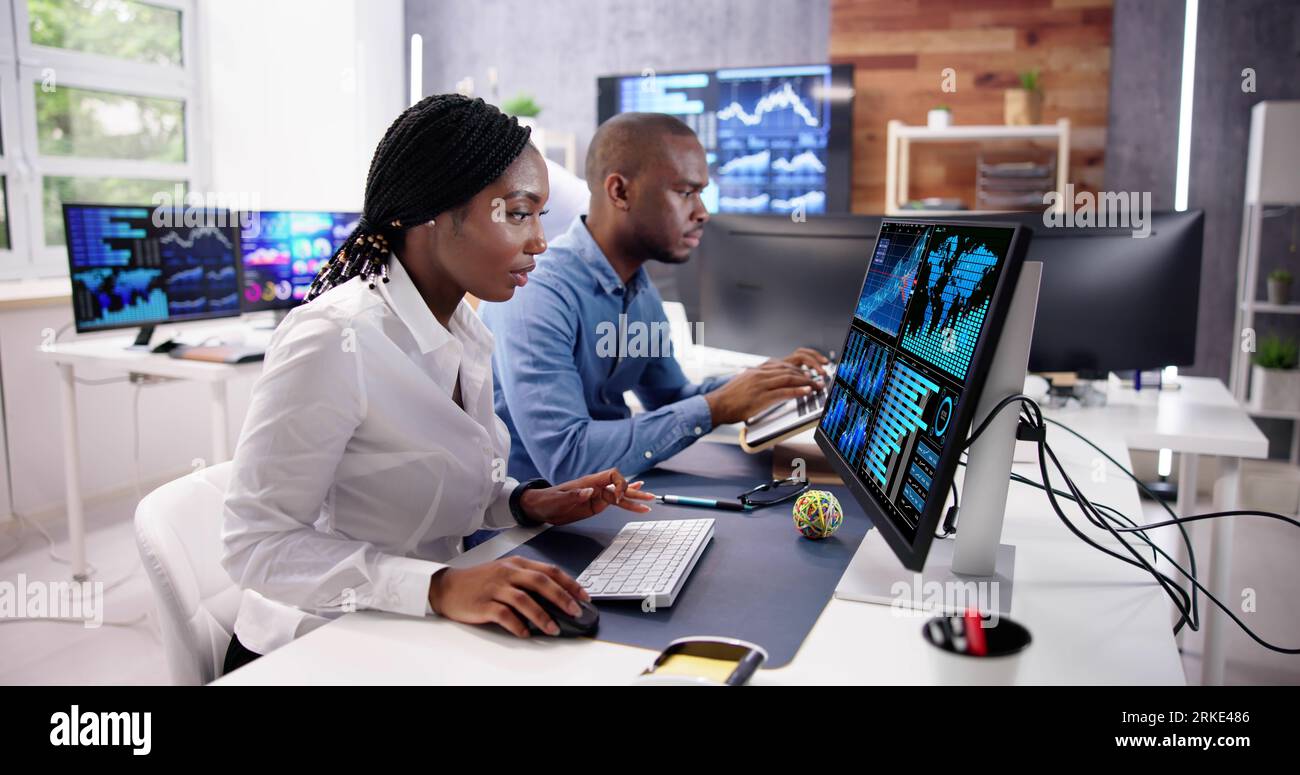 African Financial Data Analysts Using Performance Dashboard On Screens ...