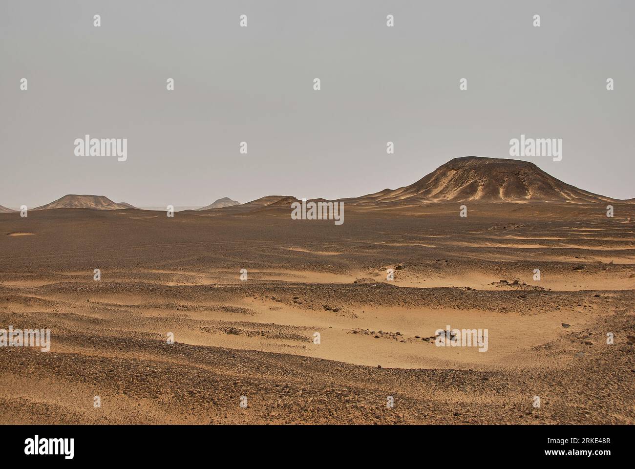 vast landscape of the dry and arid region of the black desert in Egypt ...
