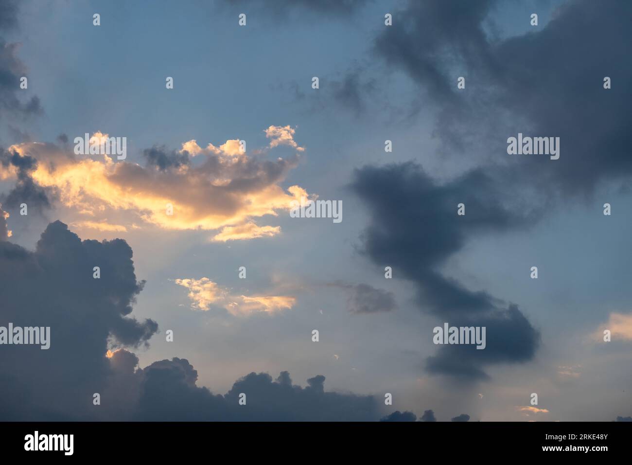 A captivating photo captures the serene evening sky as the descending ...