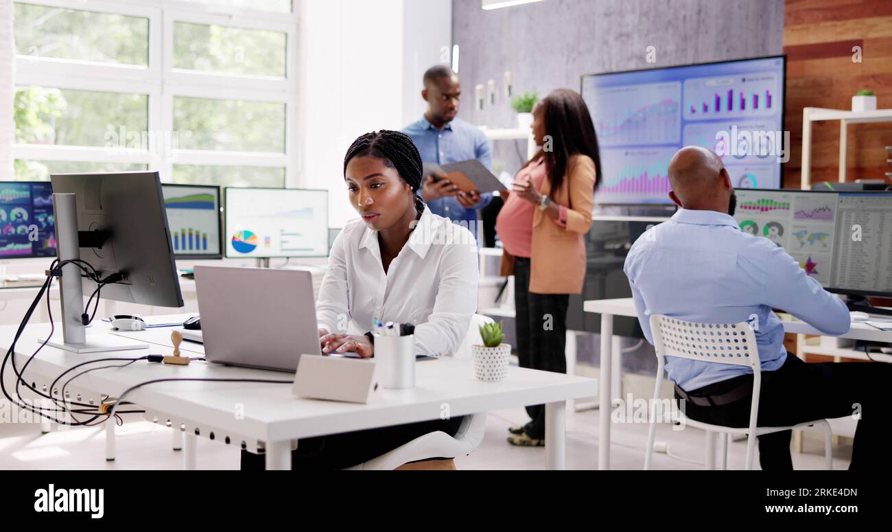African Financial Data Analysts Using Performance Dashboard On Screens ...