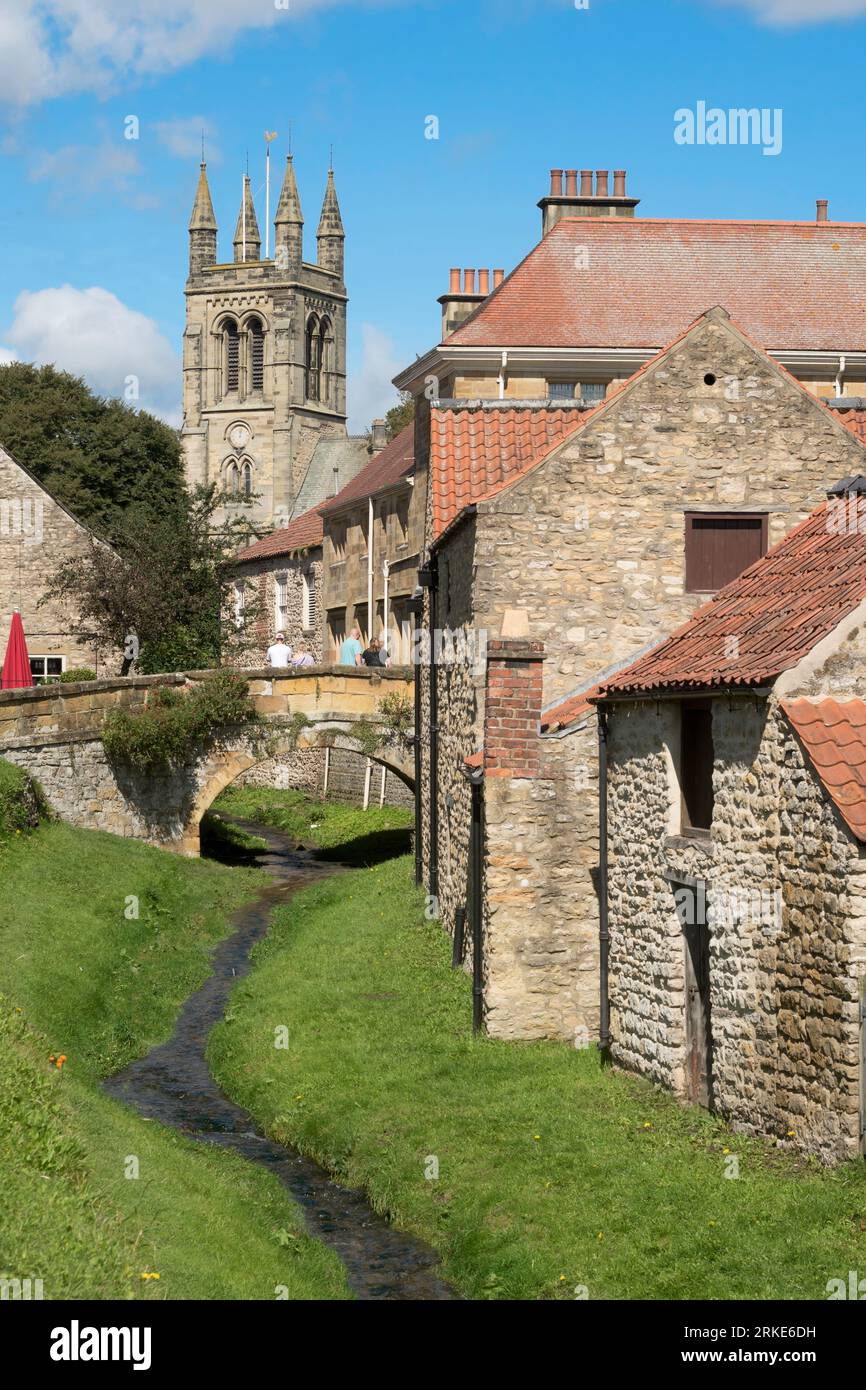 Helmsley Beck leading to the church tower in Helmsley, North Yorkshire ...