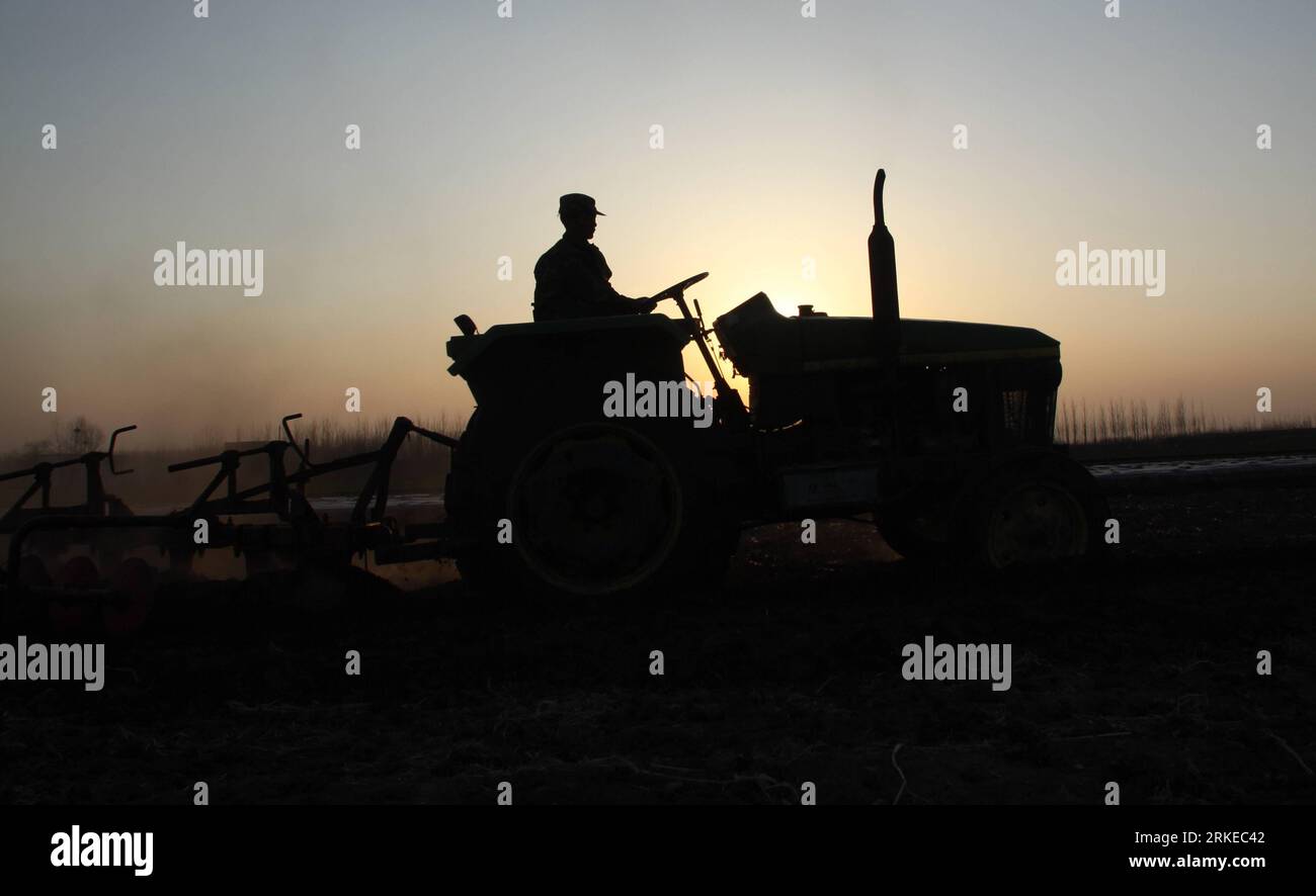 Tractor ploughing in silhouette hi-res stock photography and images - Alamy
