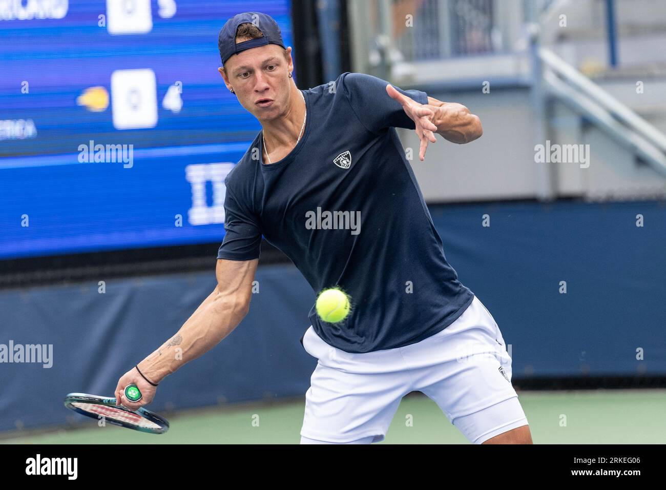 New York, New York, USA. 24th Aug, 2023. Aidan Mayo of USA returns ball ...