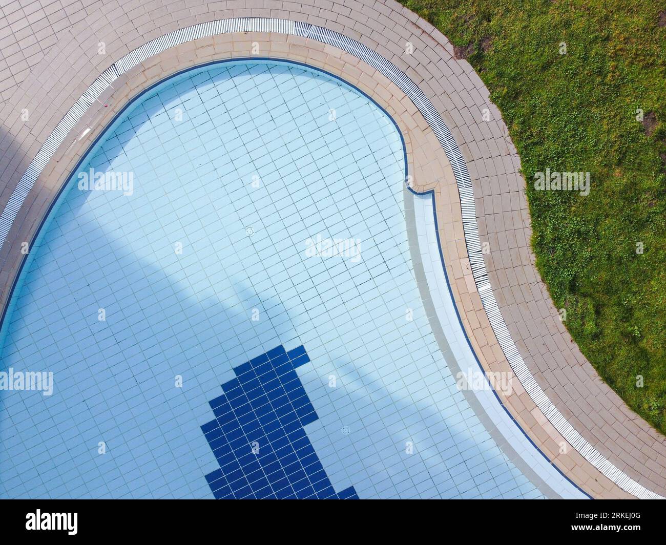 zenithal aerial view of a swimming pool of transparent water in ...
