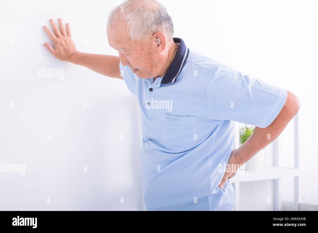 Senior man with back pain, Mature man suffering from low back pain ...