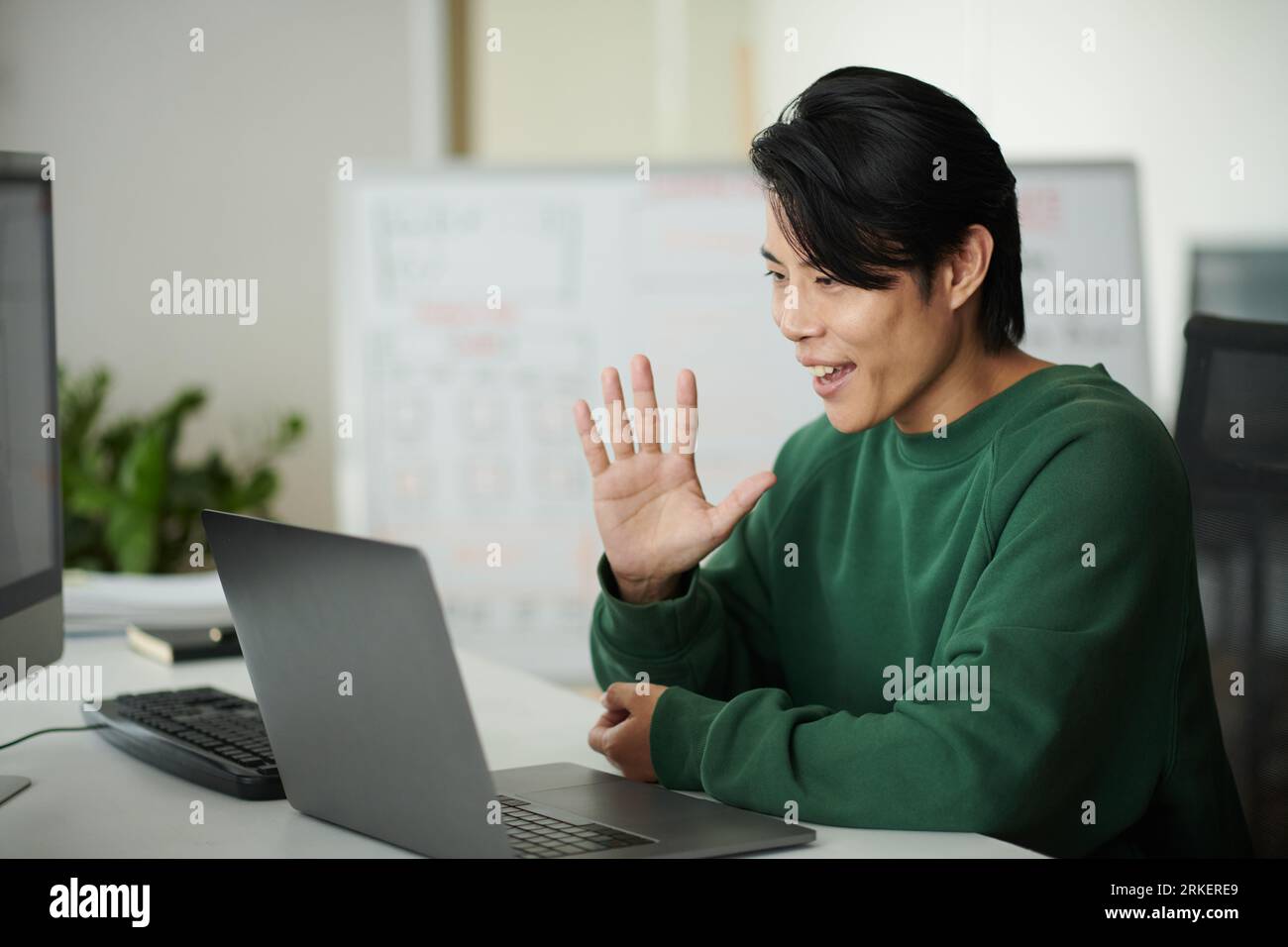 Positive software developer speaking in daily standup meeting Stock ...