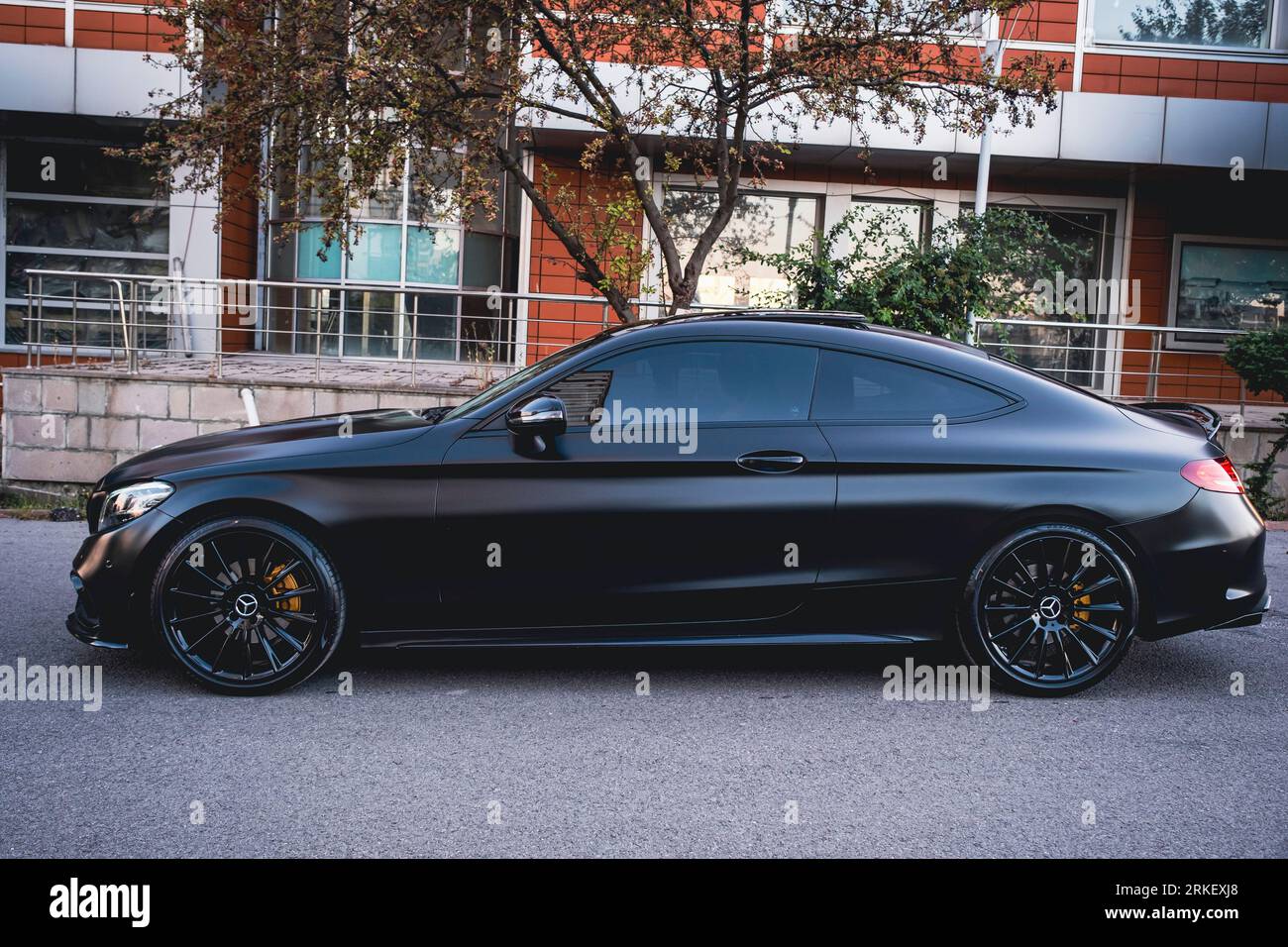 Black Mercedes Benz C63s AMG at city sunset Stock Photo - Alamy