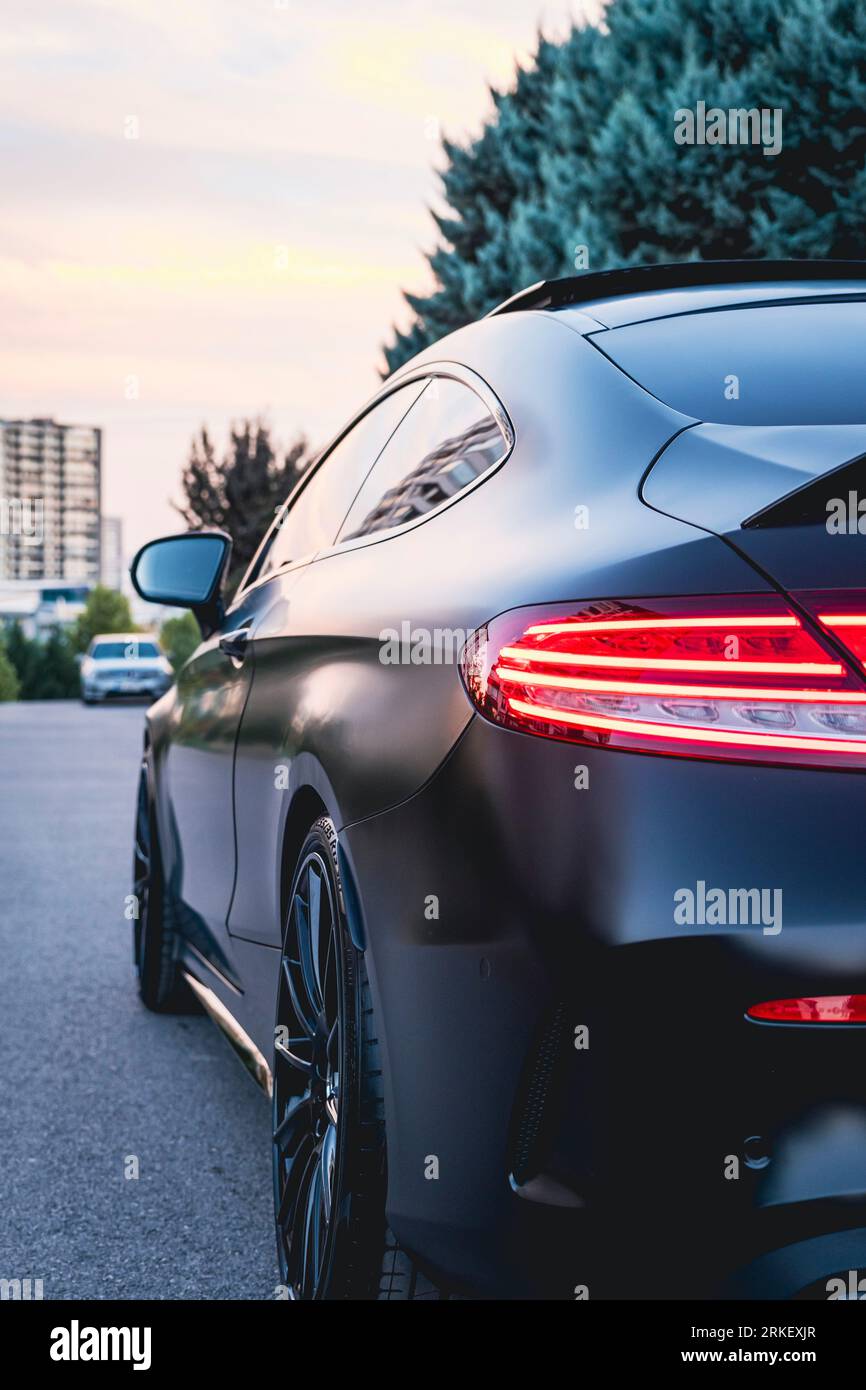 Black Mercedes Benz C63s AMG at city sunset Stock Photo - Alamy