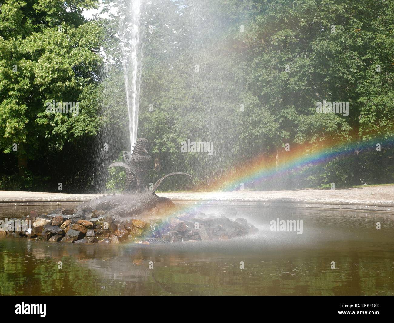Dragon Statue creating a Rainbow Stock Photo - Alamy